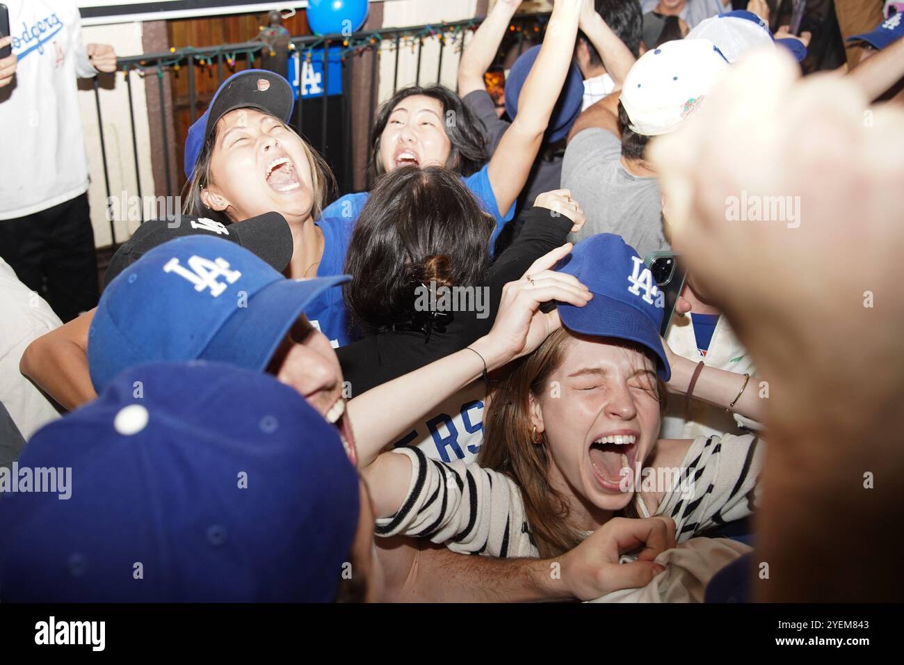 Two women yell and almost cry as they celebrate the Los Angeles Dodger ...