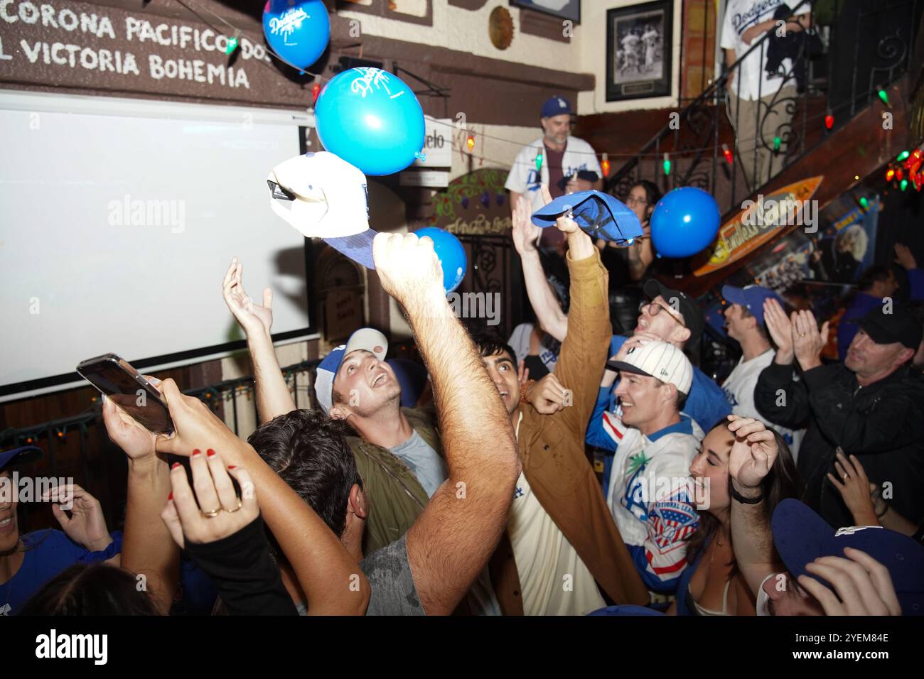 Balloons fall from the level above as fans celebrate the Los Angeles ...