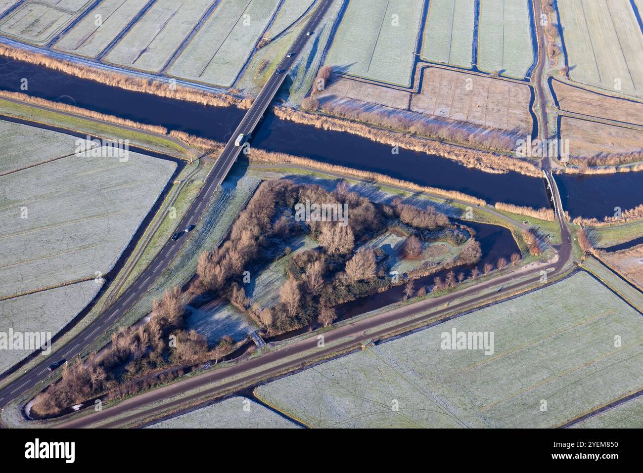 Aerial view above dutch landscape Alblasserwaard with frozen meadows ...