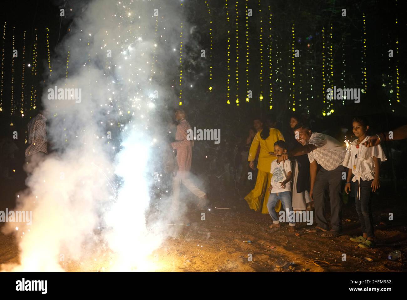 People light fire crackers during Diwali, the festival of lights in ...