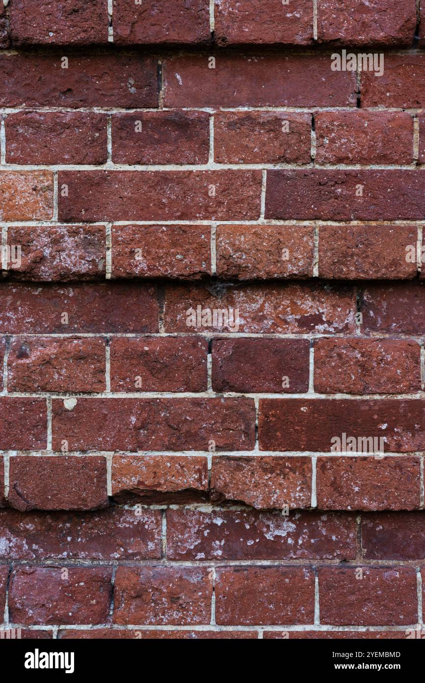 The brick wall of the castle is damaged. Brick wall background. Brick ...
