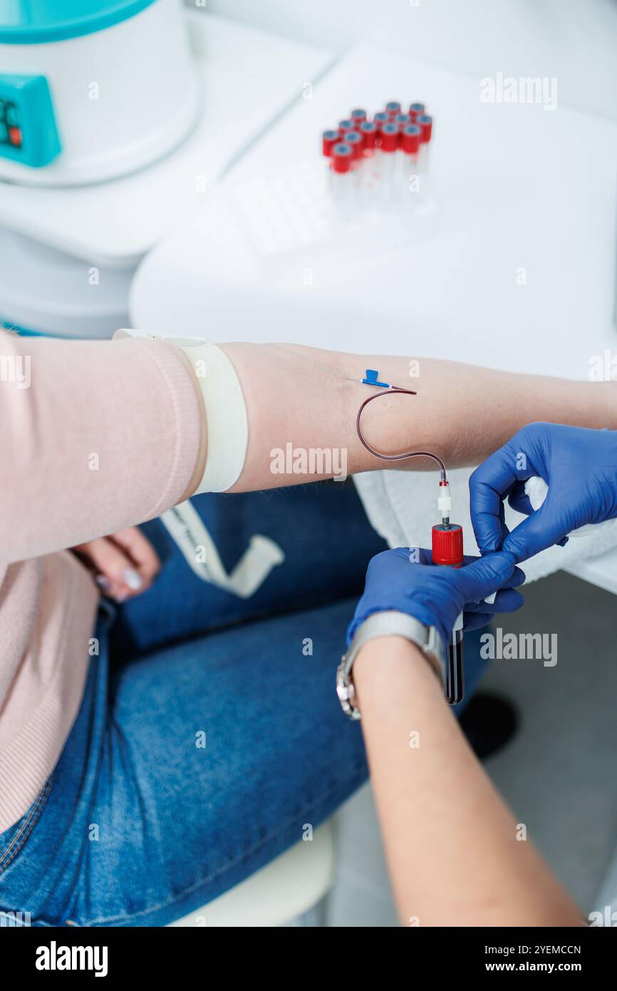 Medical procedure. Taking blood from a vein into a test tube. Sterile ...