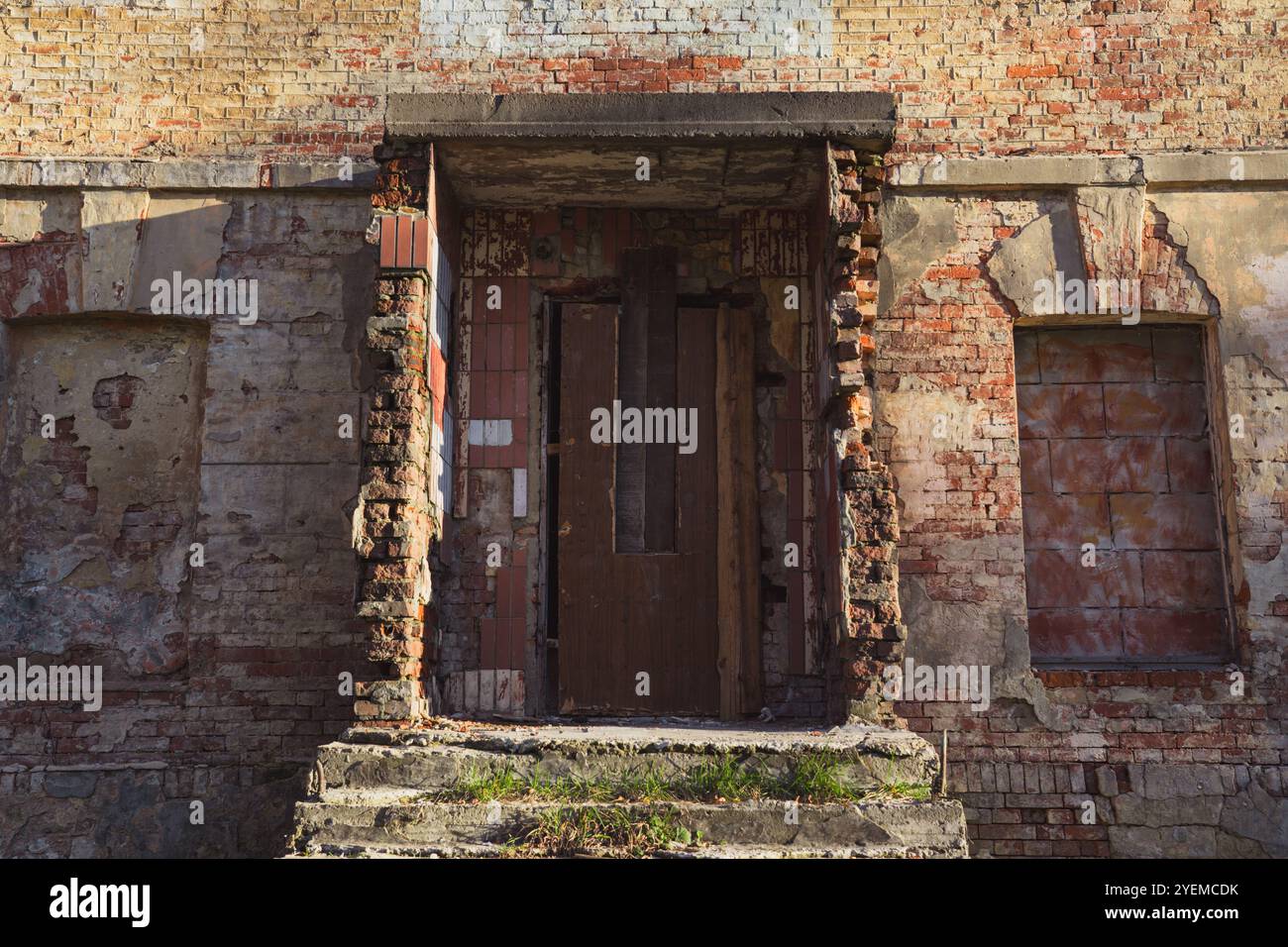 The entrance of an old, abandoned building without doors. The doorway ...
