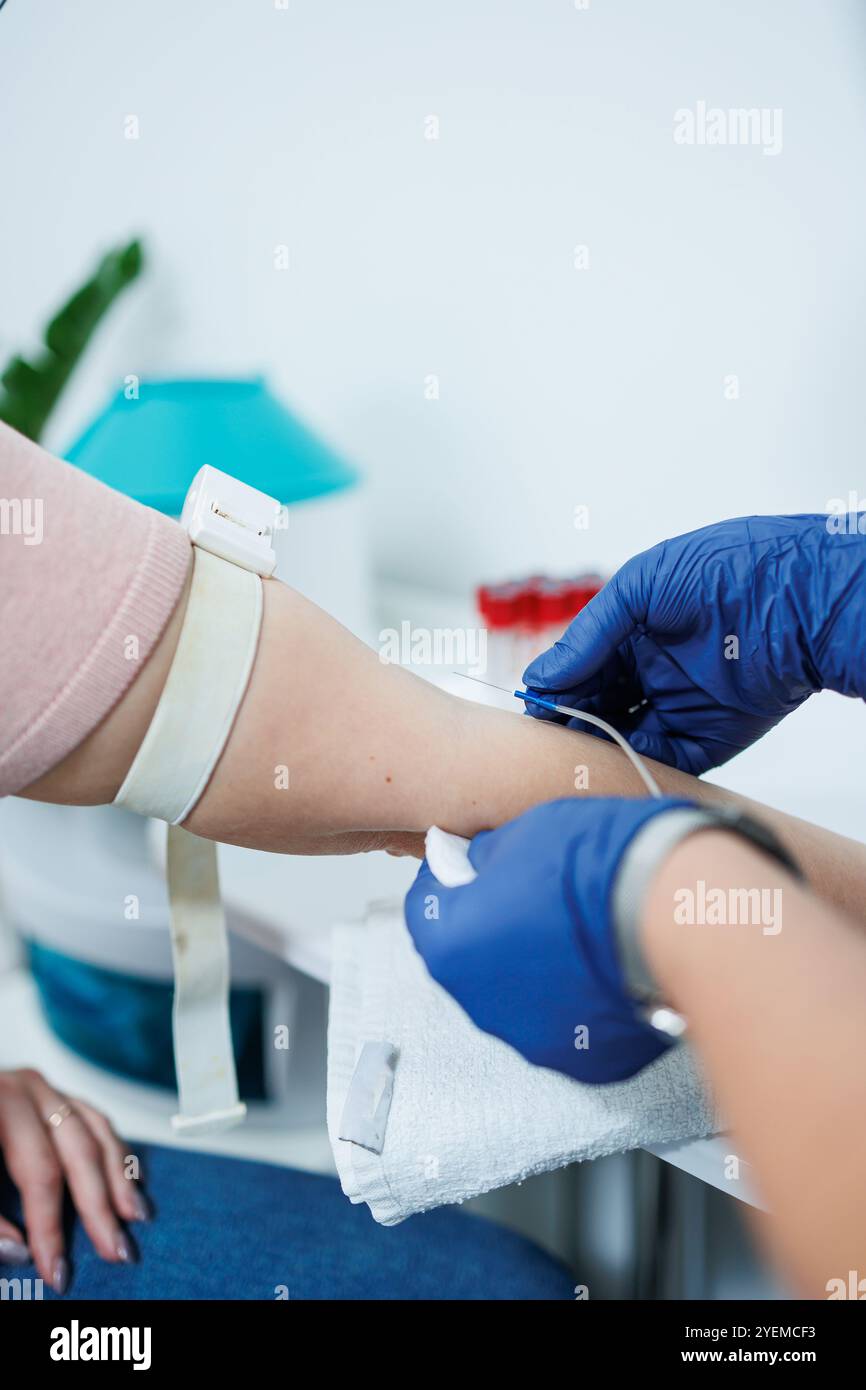 Medical procedure. Taking blood from a vein into a test tube. Sterile ...
