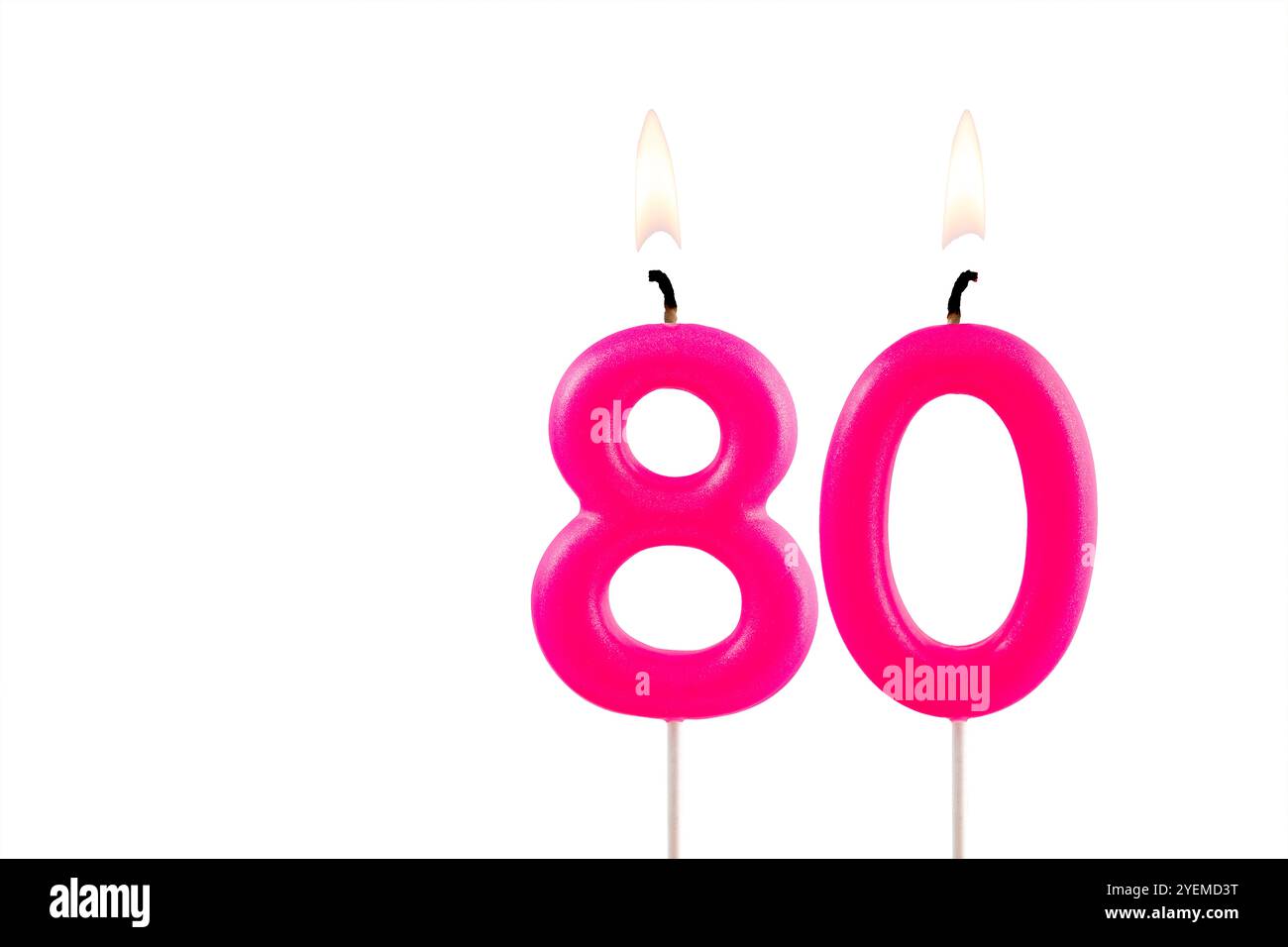 Pink number 80 birthday candle lit on white background Stock Photo - Alamy