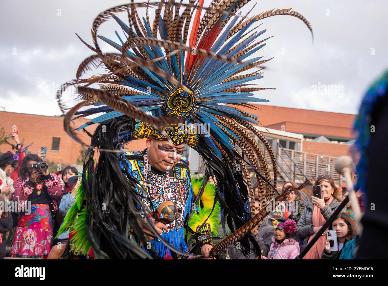 An Aztec dancer wears traditional dresses and feather headdress during ...