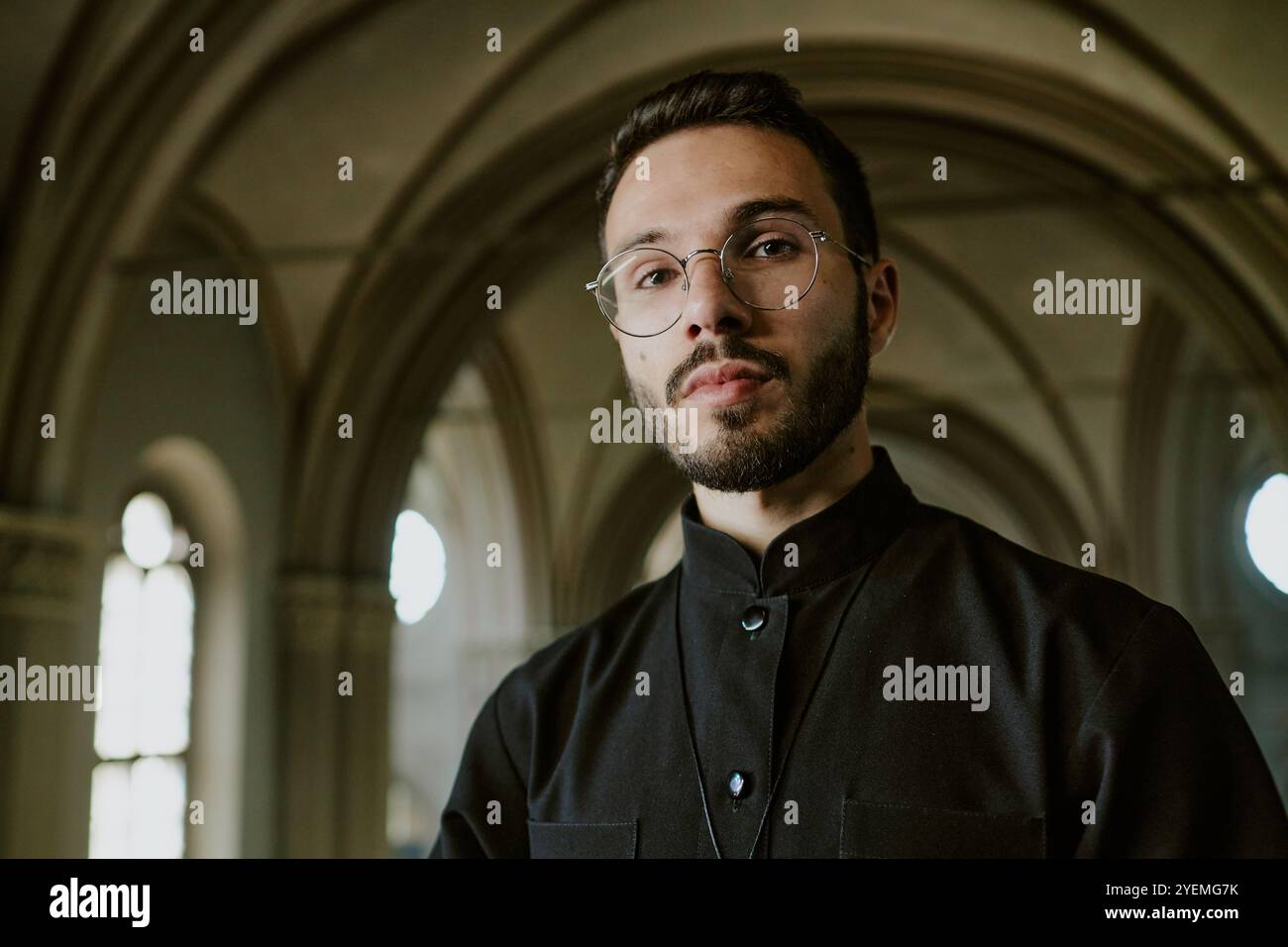 Priest wearing black robe glasses hi-res stock photography and images ...