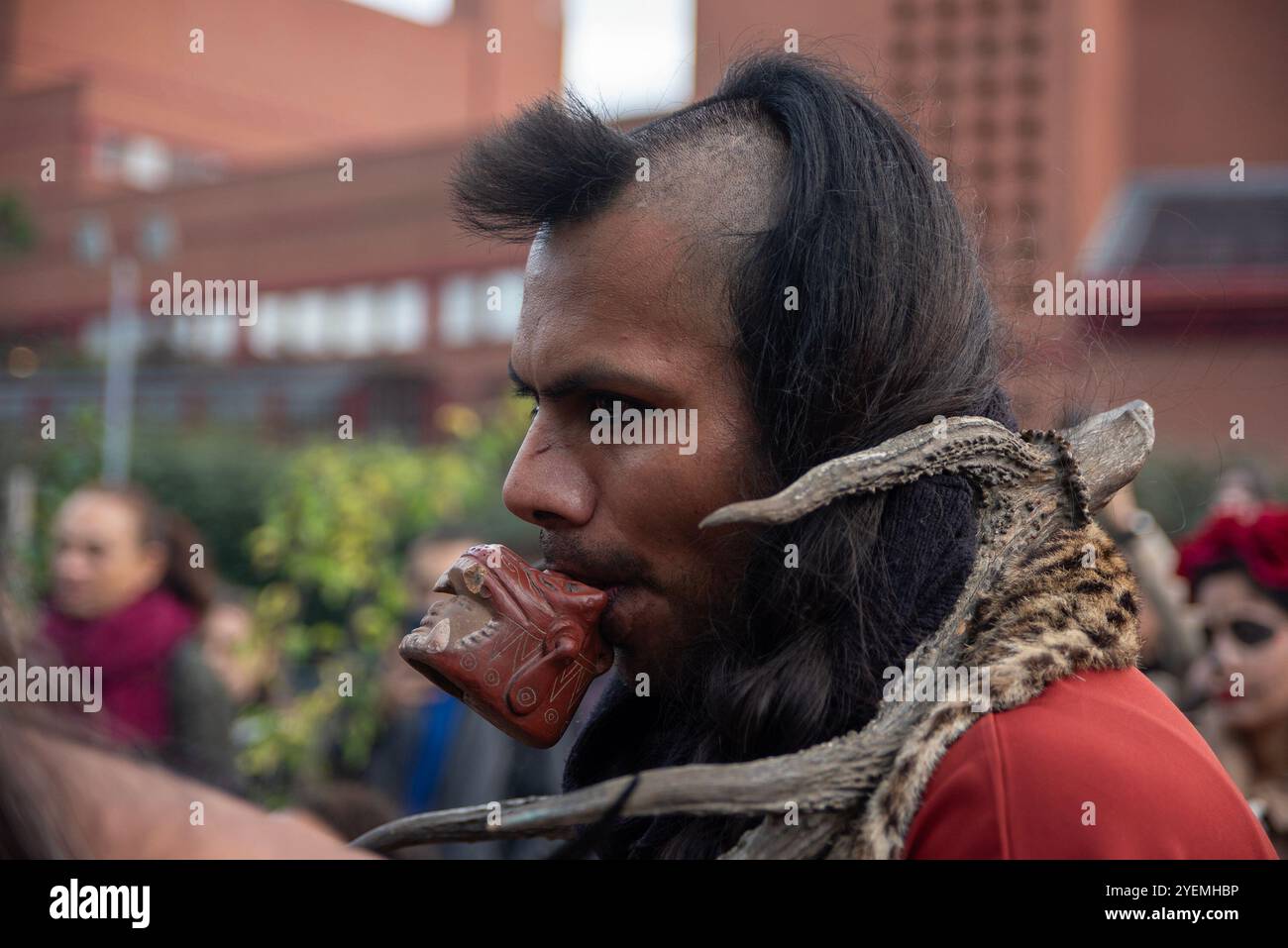 London, UK. 28th Oct, 2023. An Aztec musician blows an jaguar whistle ...