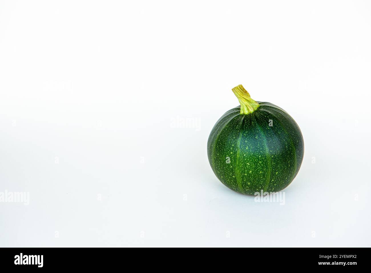 Green zucchini or round courgette - cucurbita pepo on white background ...