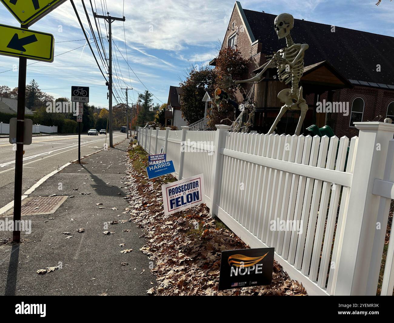 Halloween decorations and political signs for the election are ...