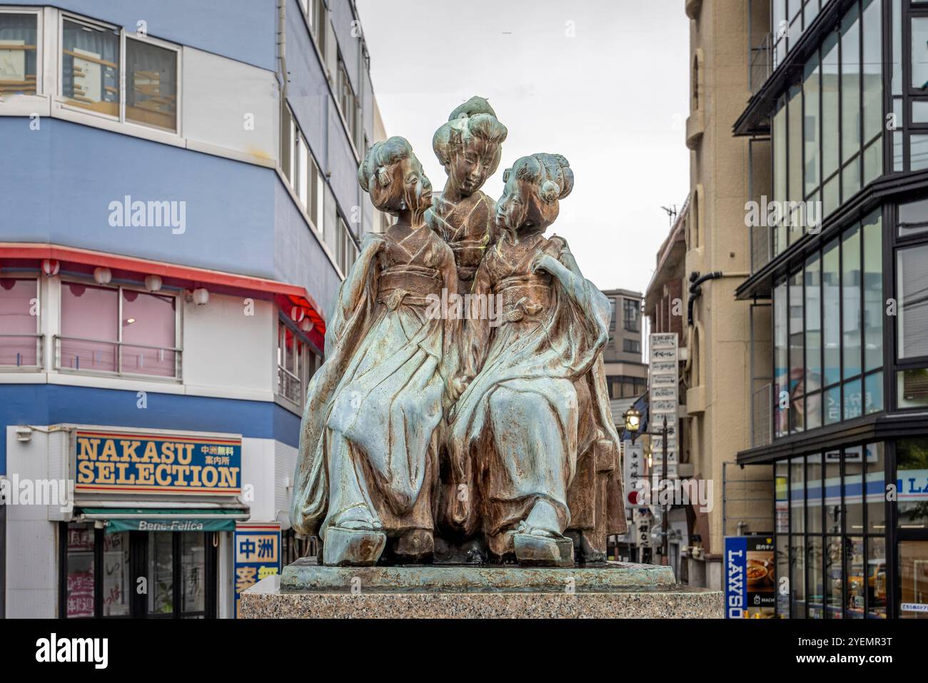 Bronze statue of three Japanese Geisha women in Kinomos alongside the ...