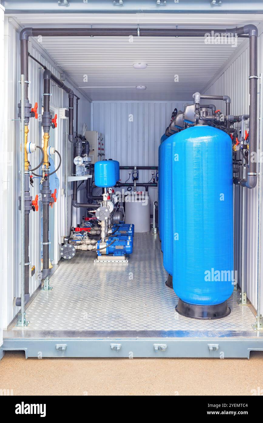 Water filtration system inside industrial container featuring blue ...