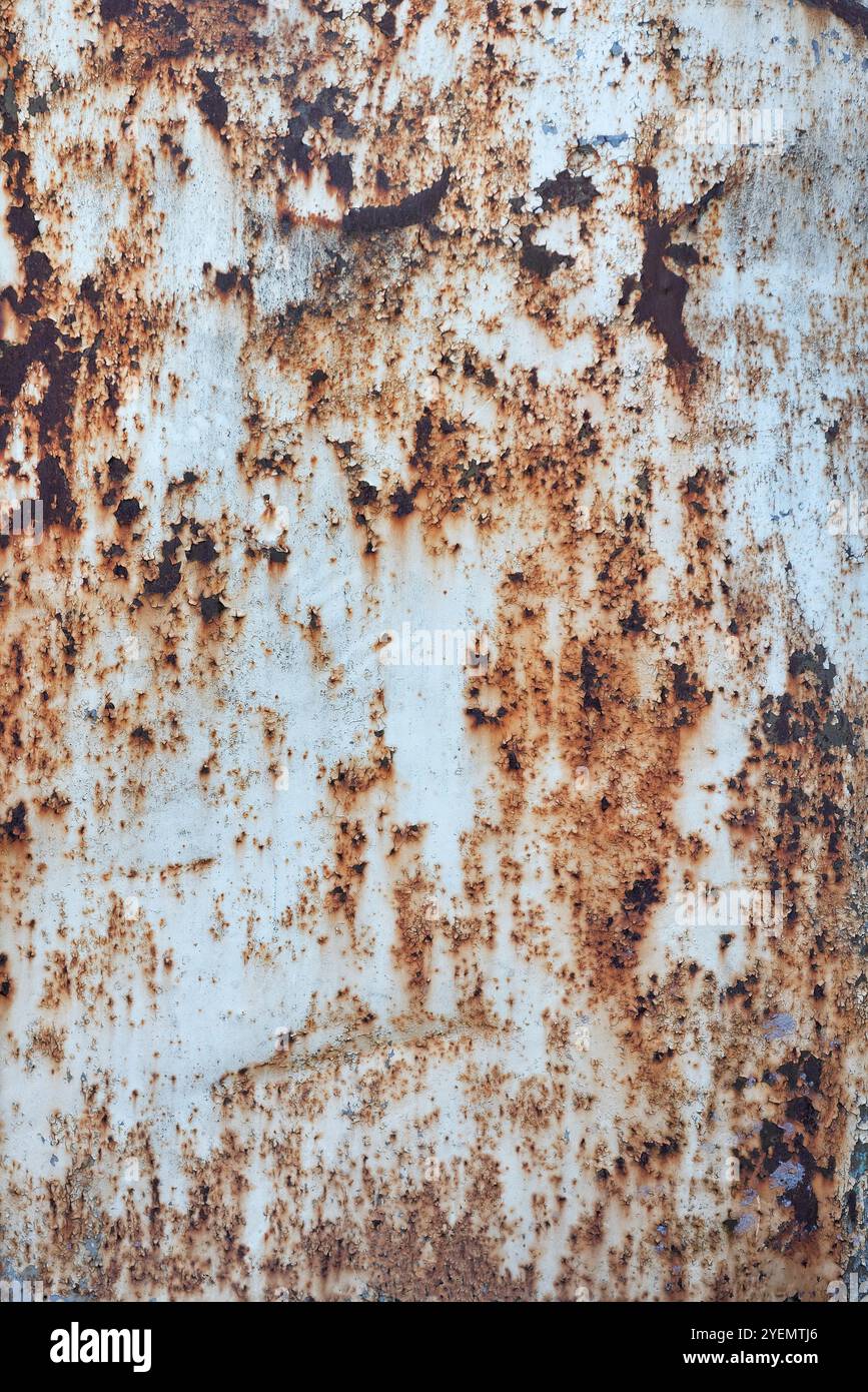 Close-up view of a rusty metal surface with natural corrosion patterns displaying a textured ...