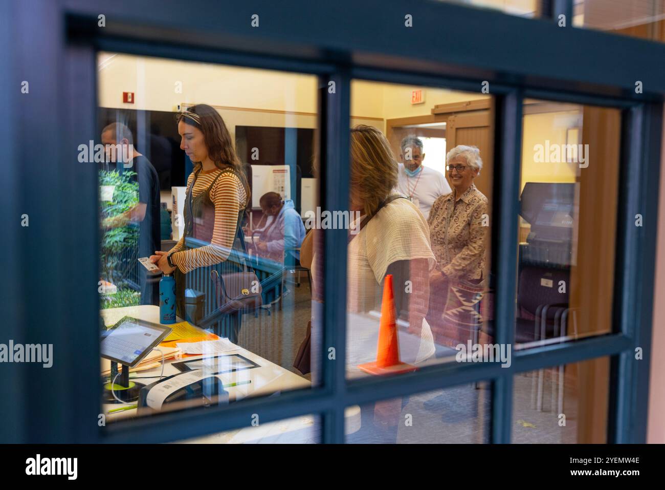Alyssa Rodriguez signs in before early voting in the 2024 election at ...