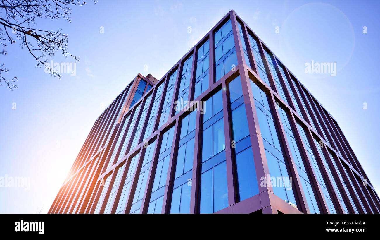 Modern stylish architecture. Symmetrical blue glass building in the ...