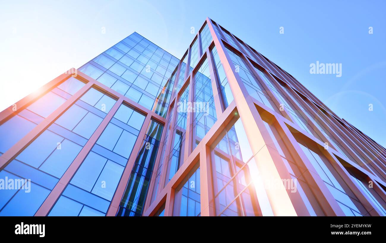 Modern stylish architecture. Symmetrical blue glass building in the ...