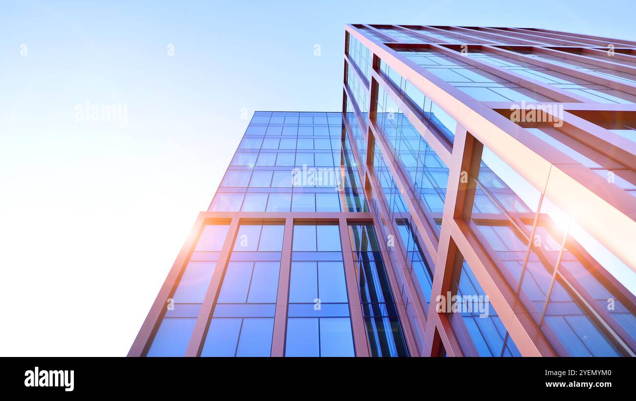 Modern stylish architecture. Symmetrical blue glass building in the ...