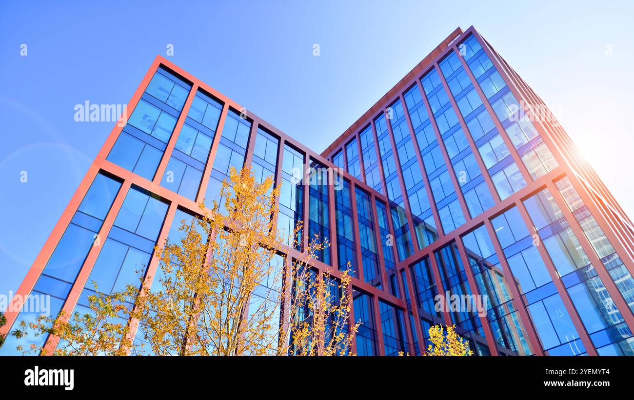 Sustainable glass office building with trees for reducing carbon ...