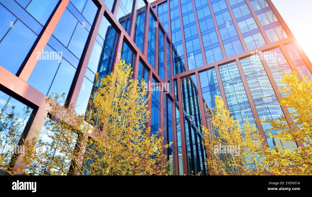Sustainable glass office building with trees for reducing carbon ...