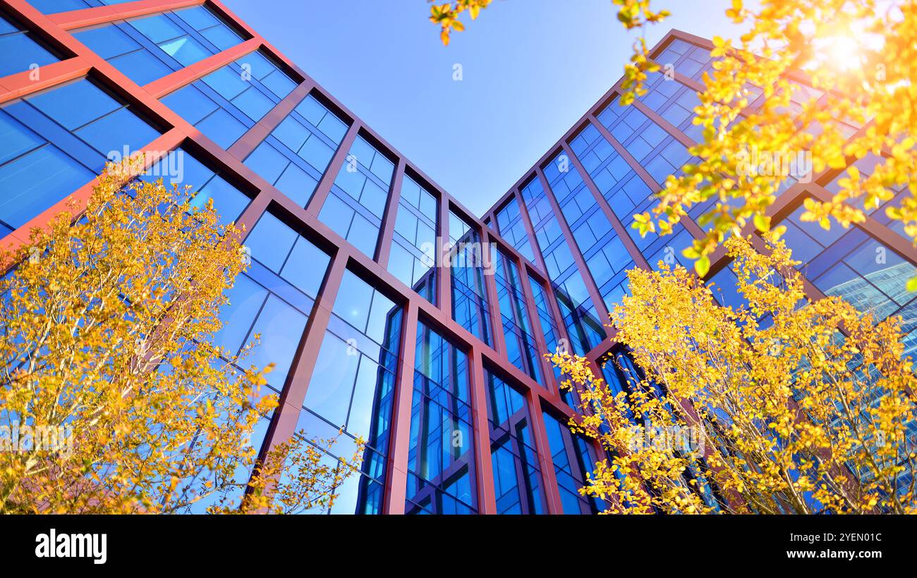 Sustainable glass office building with trees for reducing carbon ...