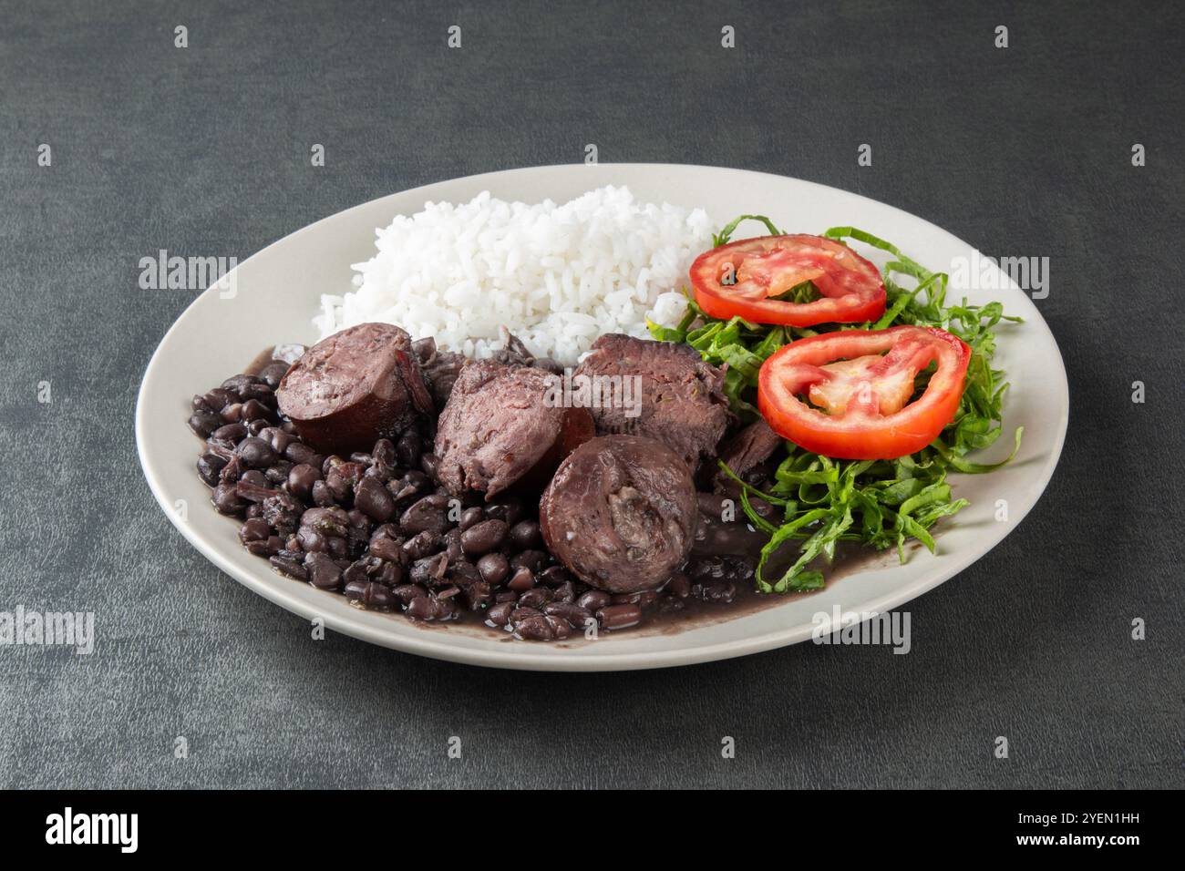 Plate with traditional Brazilian Feijoada with a gray background Stock ...