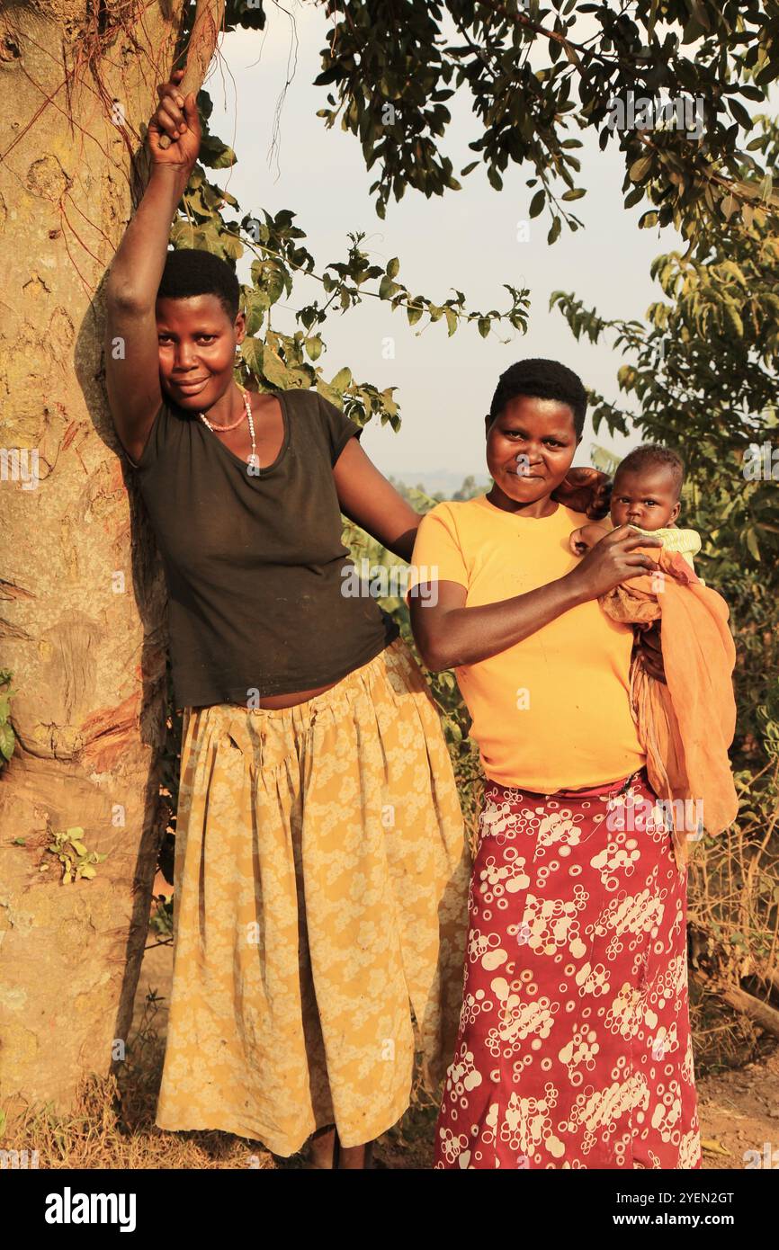 Portrait of two Ugandan women from a remote village, with one mother ...