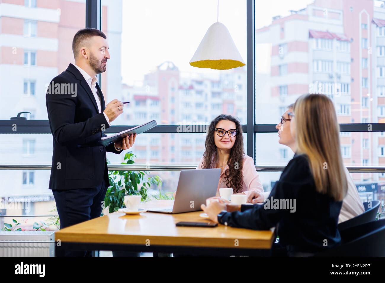 The boss stands with the charts, demonstrates statistics, various ...
