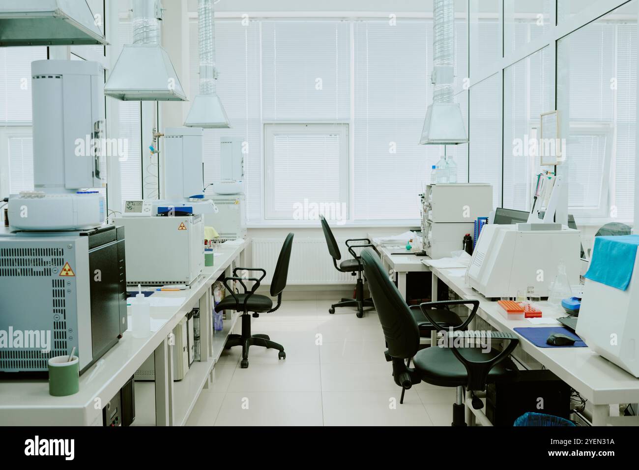 Clean, organized laboratory filled with advanced scientific equipment ...