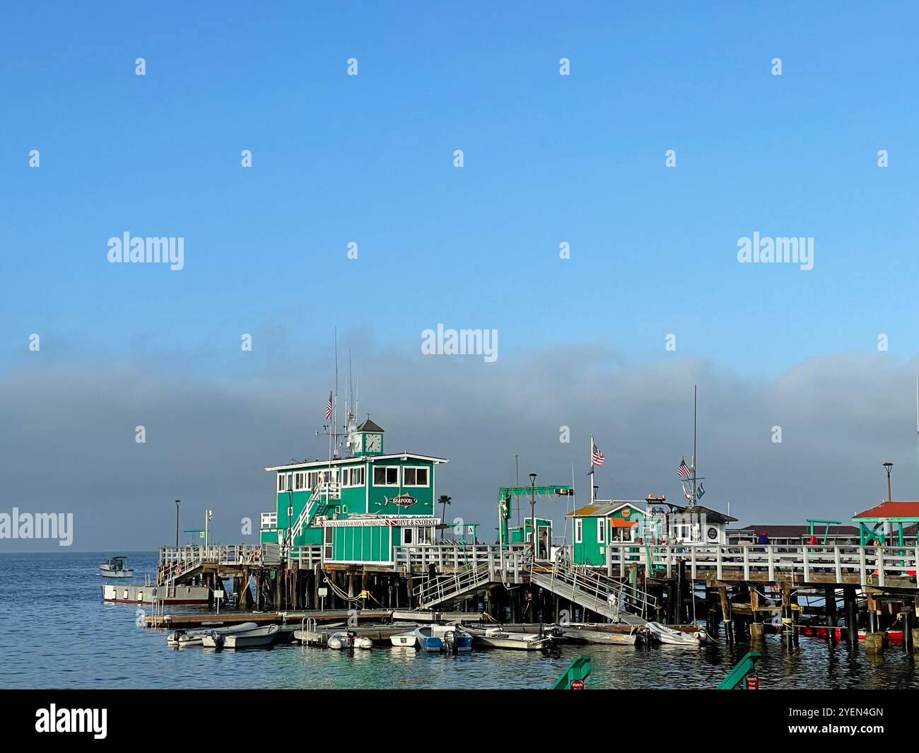 Pier with Green building Stock Photo - Alamy
