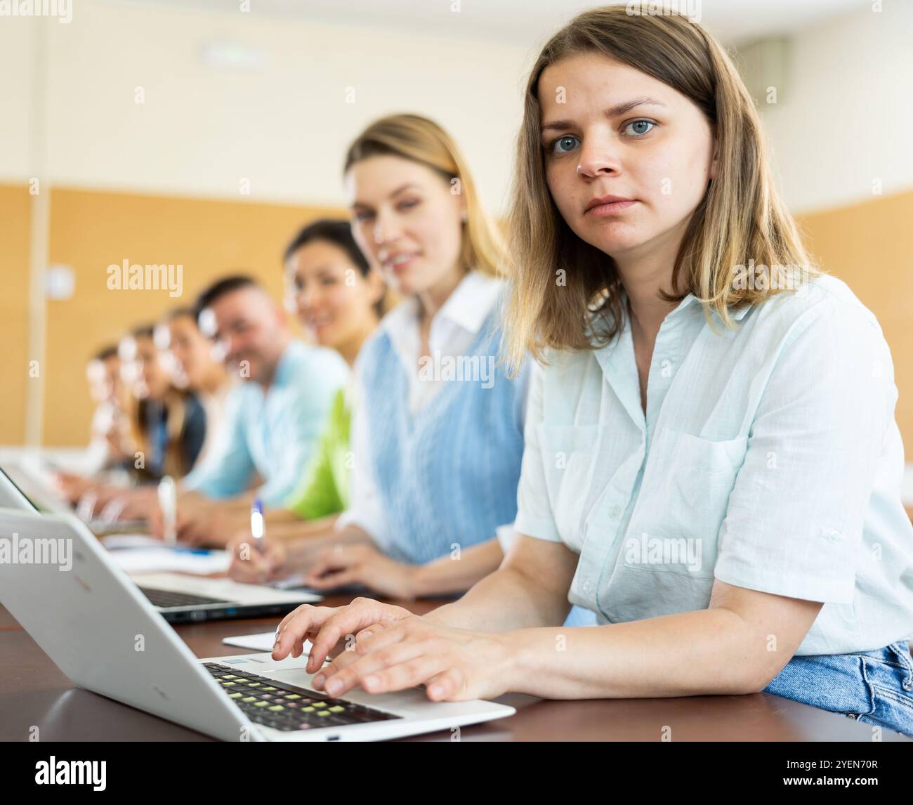 Portrait of a girl student studying on a laptop during class Stock ...