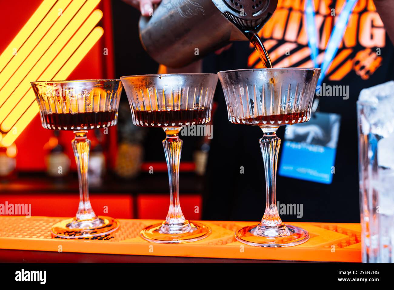 Cocktail preparation and tasting event at a vibrant bar scene Stock ...