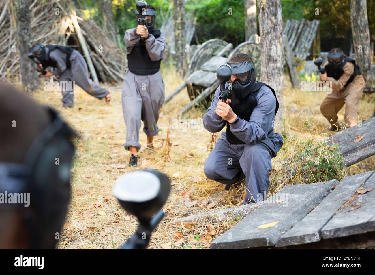 Tactical paintball team fighting on outdoor location Stock Photo - Alamy