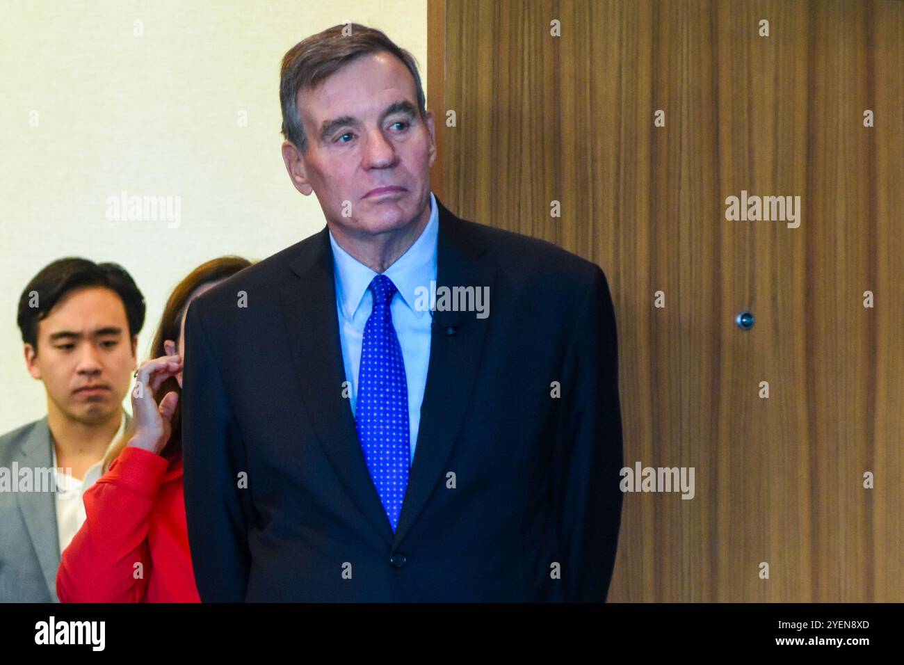 Sen. Mark Warner (D-Va.) prepares to take the stage with Punchbowl News ...