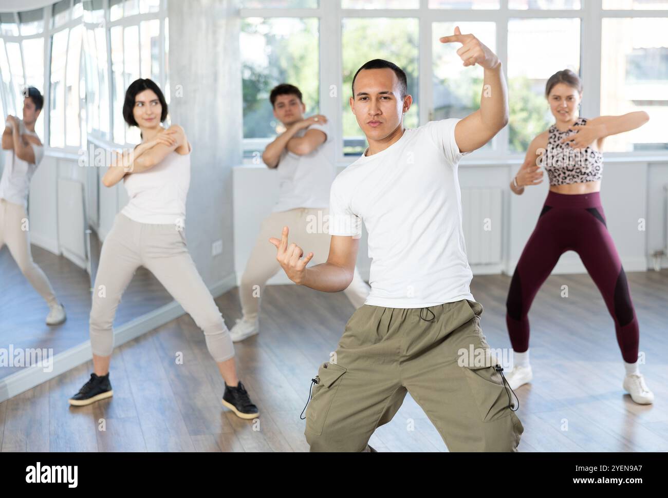 Guy enjoys active dancing, learns new movements, moves synchronously ...