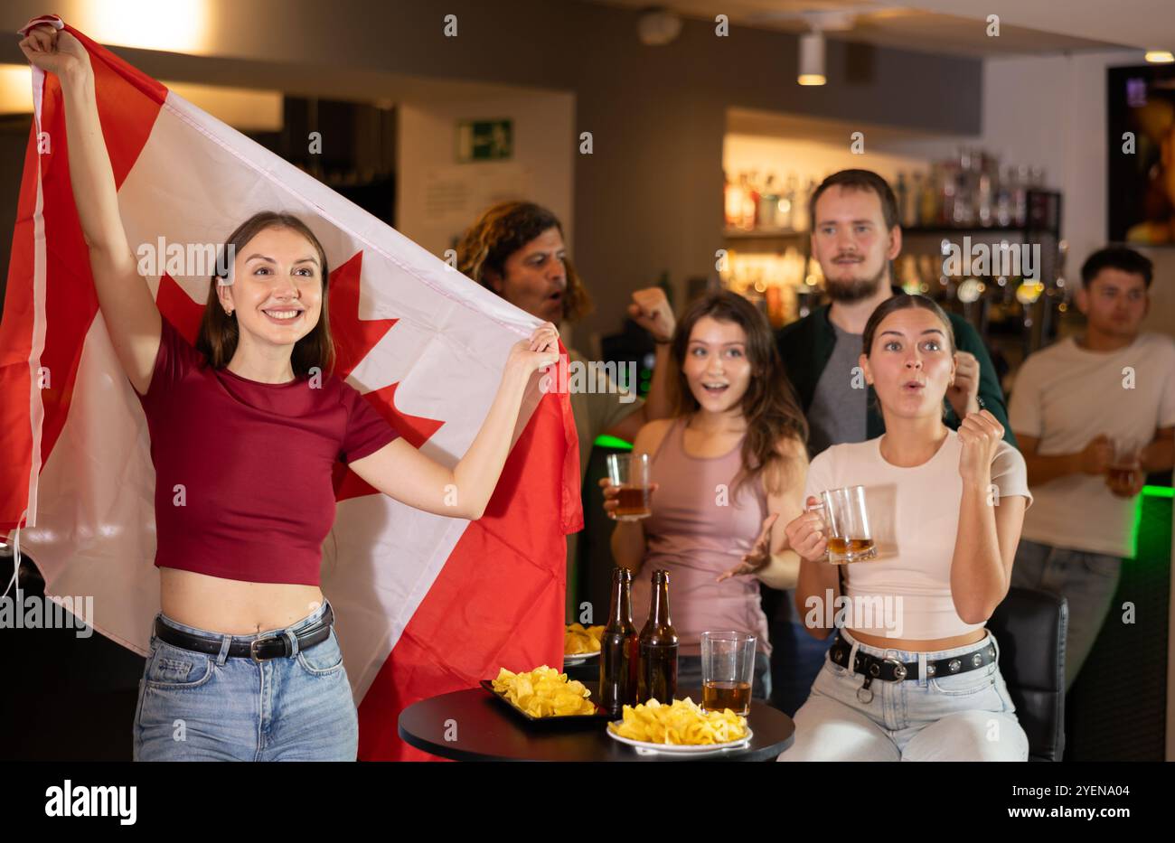Excited canadian fans cheer for their team as they watch the match on ...