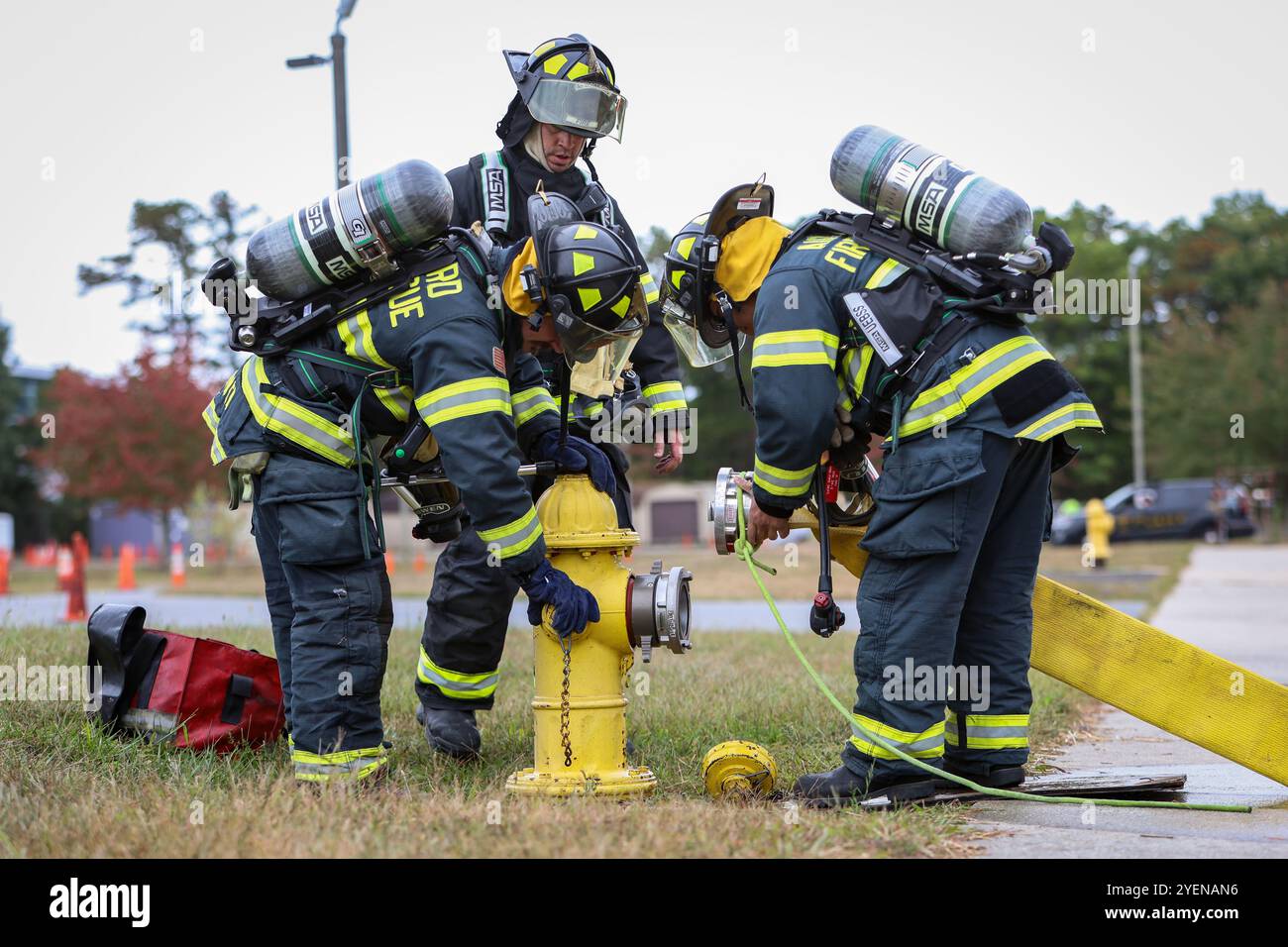 From left, Mr. Robert Bowen, U.S. Air Force Tech. Sgt. Jaime Torres ...