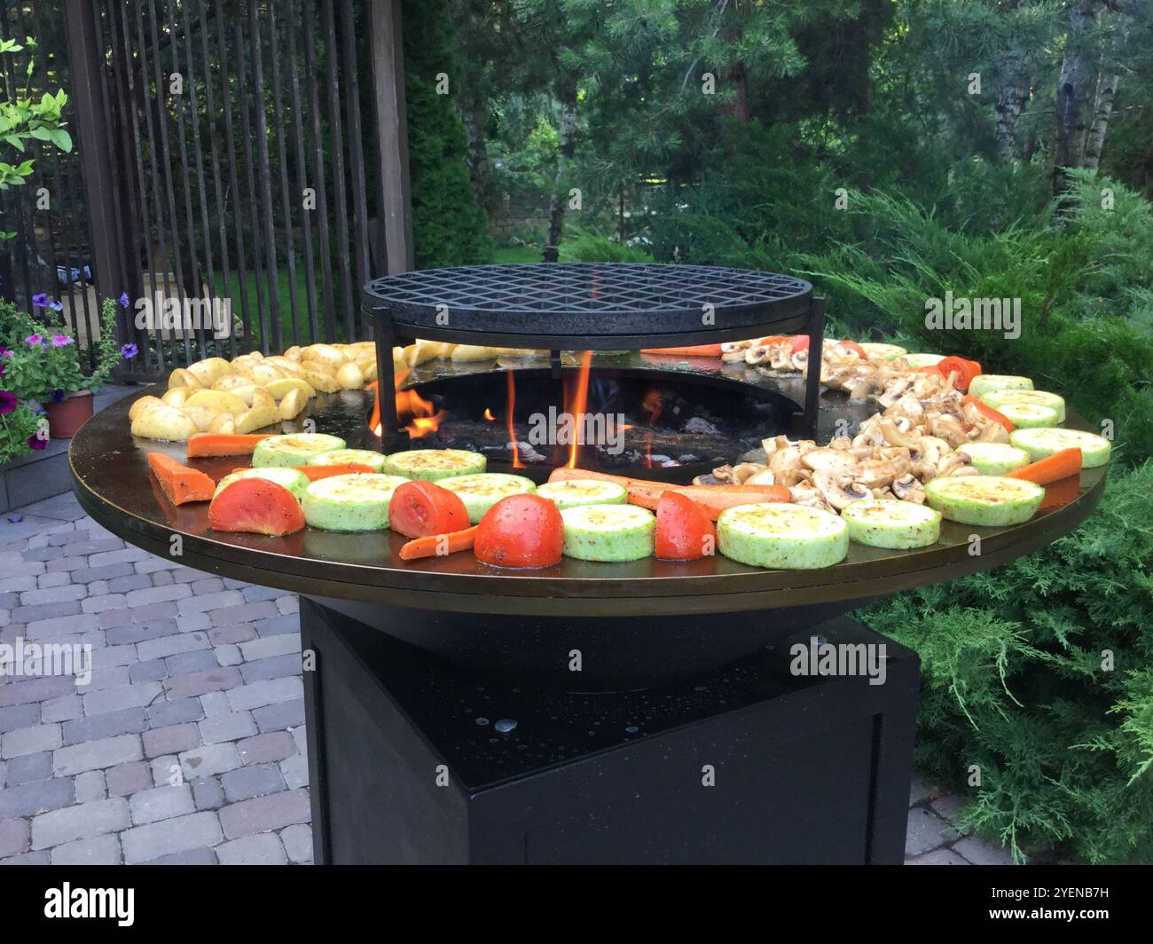 Outdoor Barbecue With Vegetables On Round Grill Fire Pit Stock Photo ...