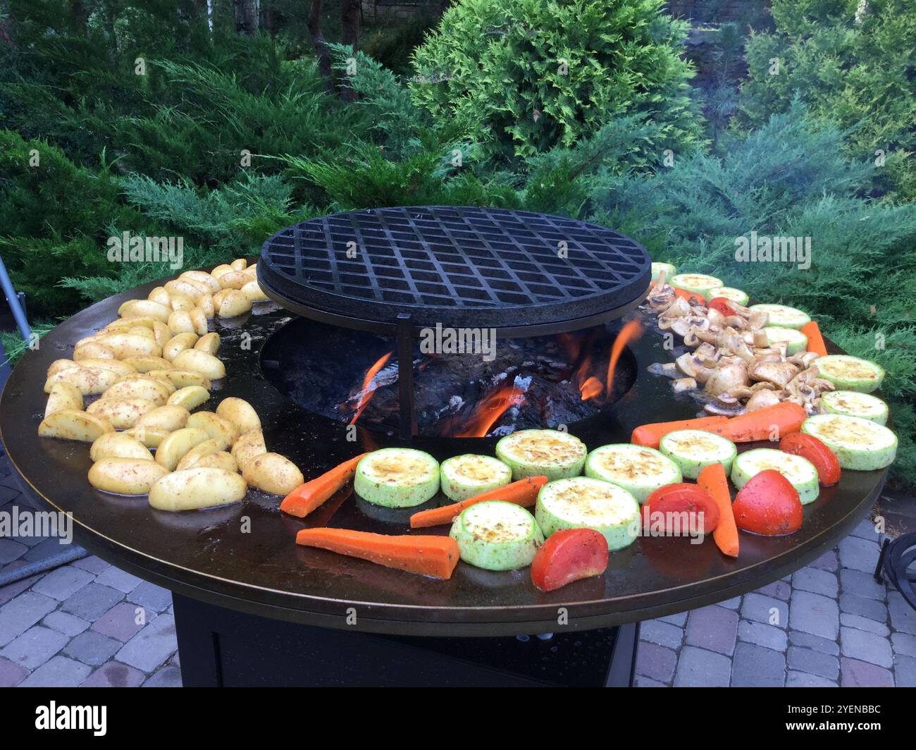 Outdoor Barbecue with Grilled Vegetables on Circular Grill Stock Photo ...