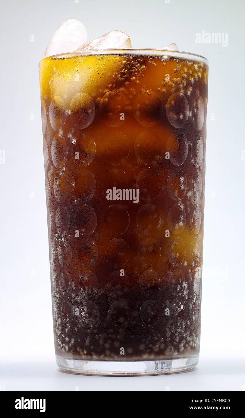 Tall, cold glass of soda soft drink with ice isolated Stock Photo - Alamy