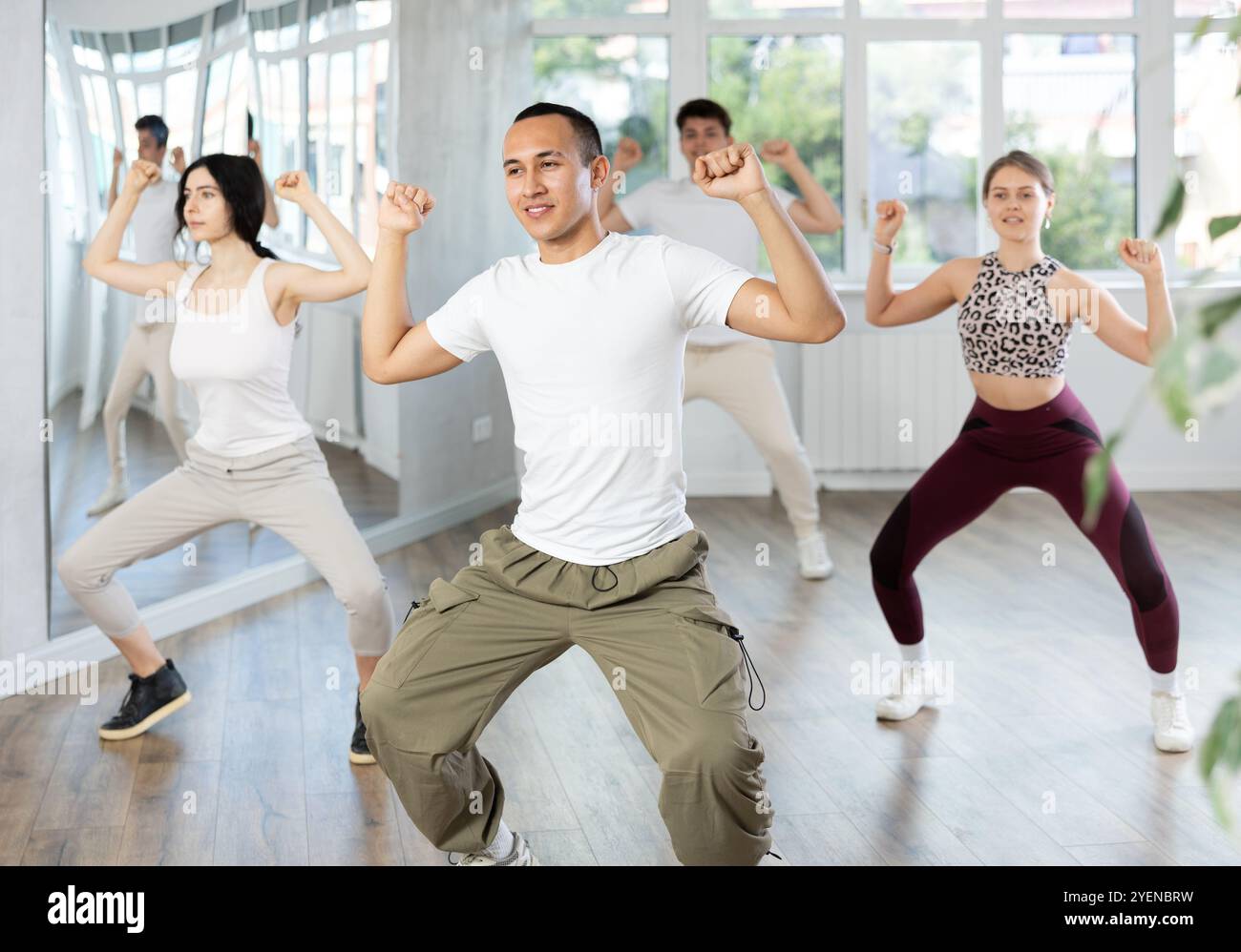 Expressive Asian guy honing hip-hop dance moves in studio Stock Photo ...