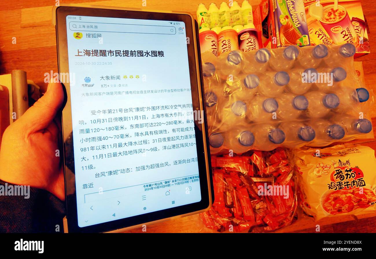 SHANGHAI, CHINA - OCTOBER 30, 2024 - People display food such as ...