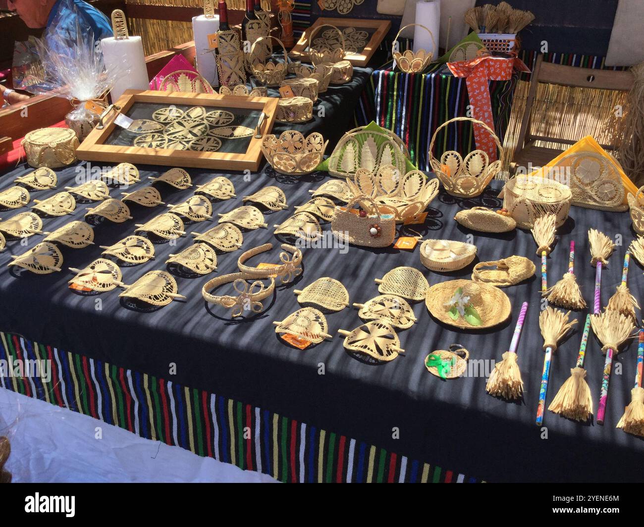 Handcrafted Straw Art Display at Outdoor Market Stall Stock Photo - Alamy