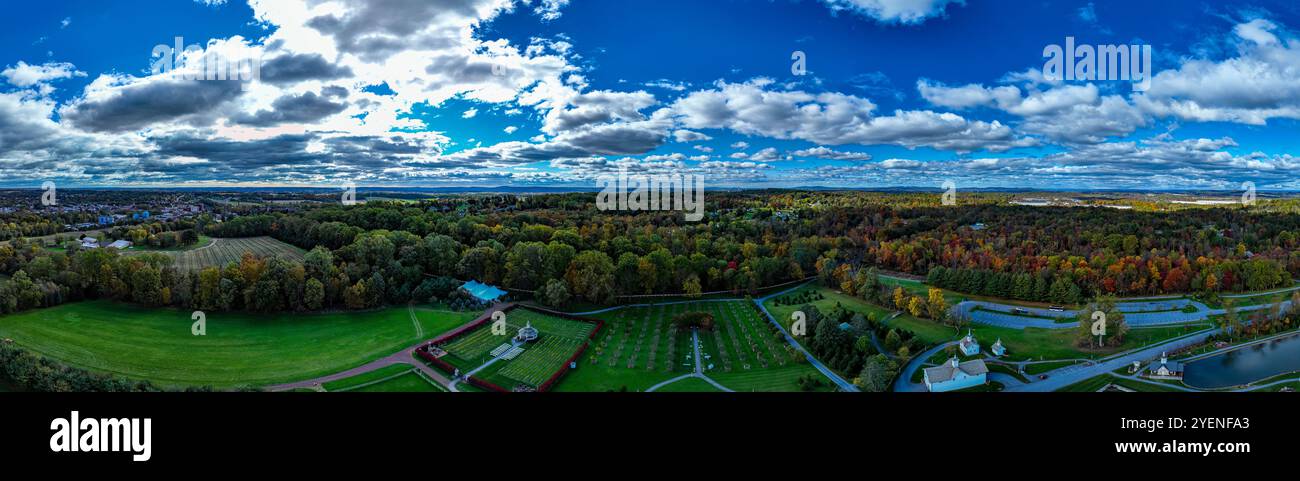 A sweeping landscape showcases colorful autumn trees alongside lush ...
