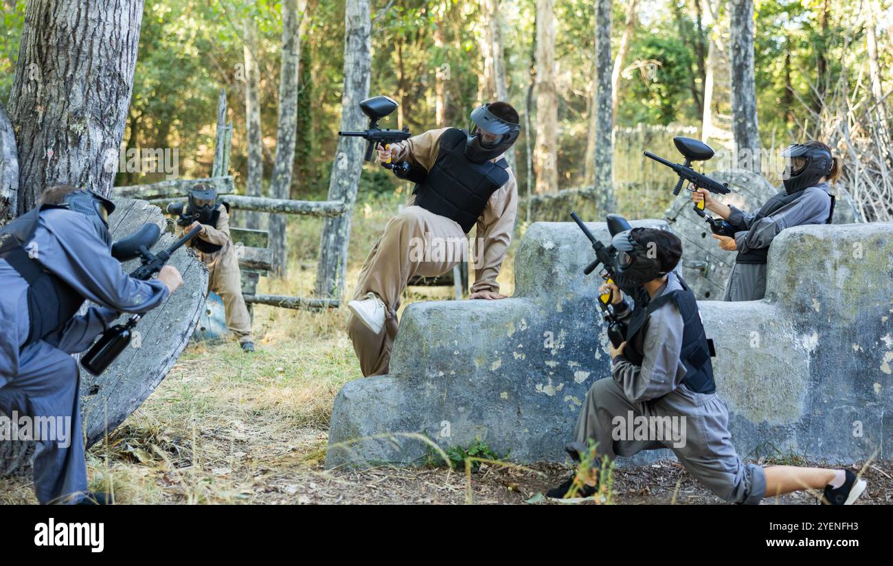 Paintball team rushing enemy positions on battleground Stock Photo - Alamy
