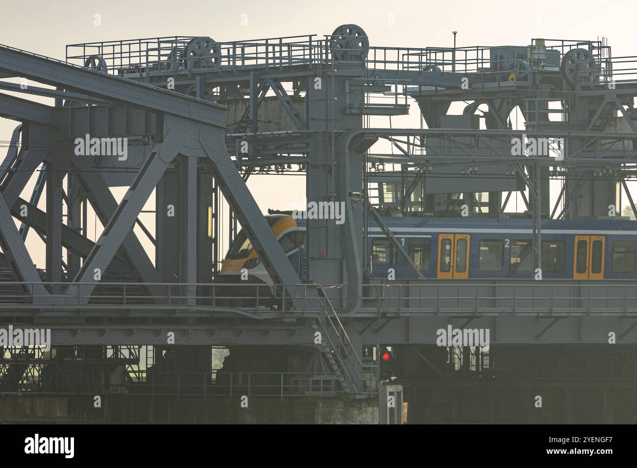 Backlit steel draw bridge Oude IJsselbrug with Dutch railway train ...
