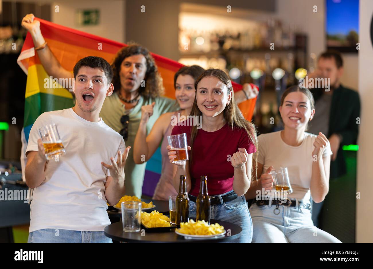 Sports fans with LGBT flag celebrate their favorite team victory in ...