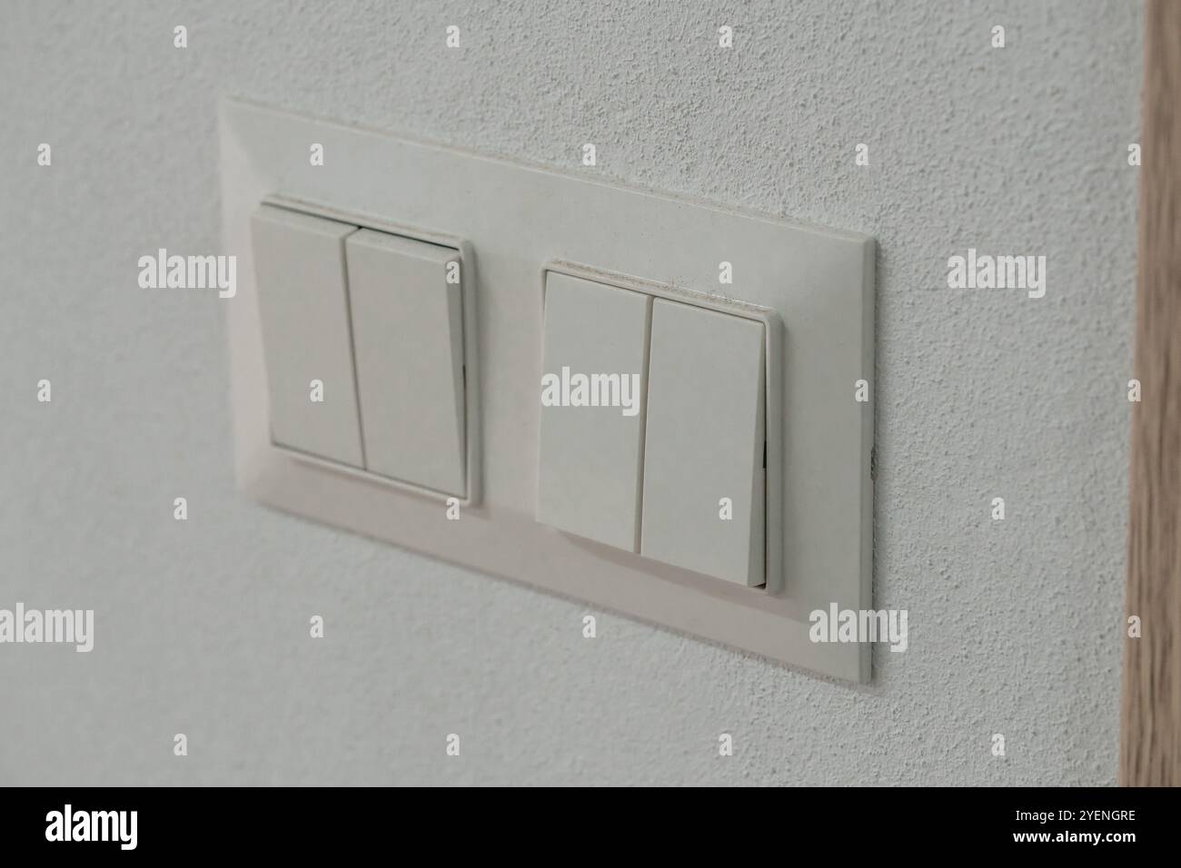 Modern Dual Light Switch on Textured Wall Stock Photo - Alamy
