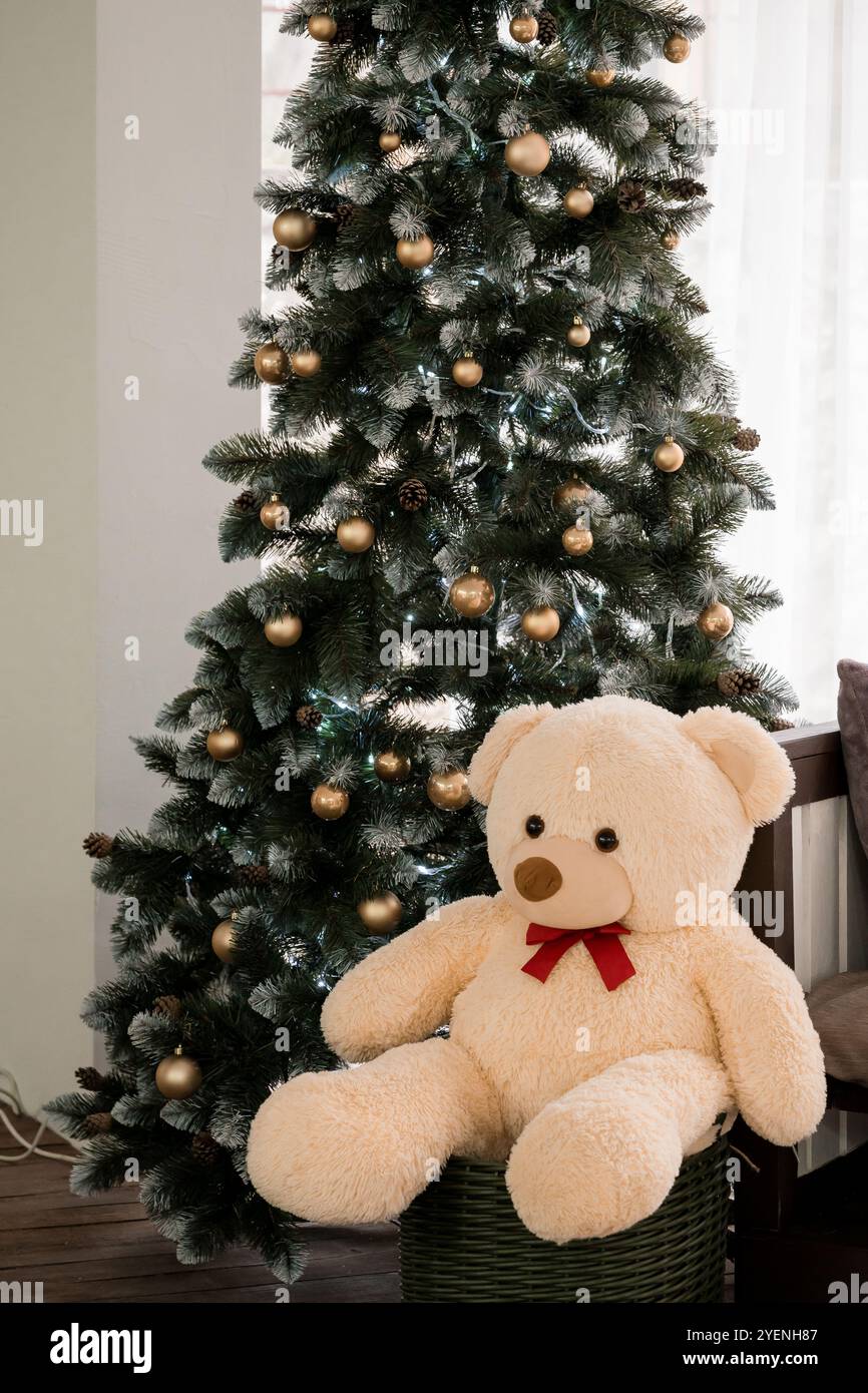 Cozy Christmas Scene with a Plush Teddy Bear and Ornamented Tree Stock ...