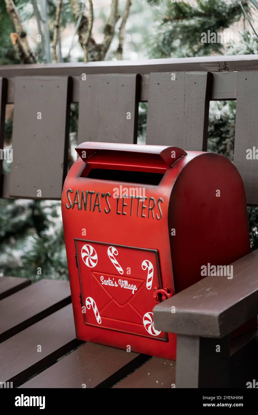 Festive Red Santa's Letters Mailbox Surrounded by Christmas Trees Stock ...