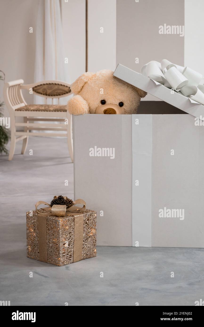 Cozy Holiday Surprise with Teddy Bear and Gift Box Stock Photo - Alamy